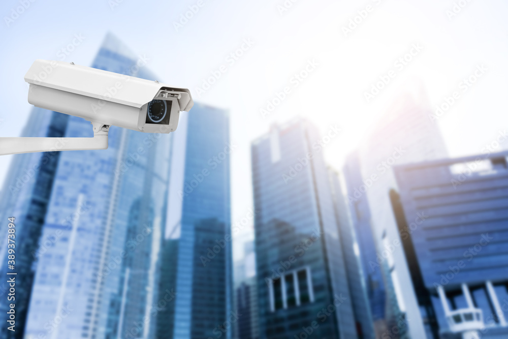 Modern public CCTV camera on wall with blur building background ...
