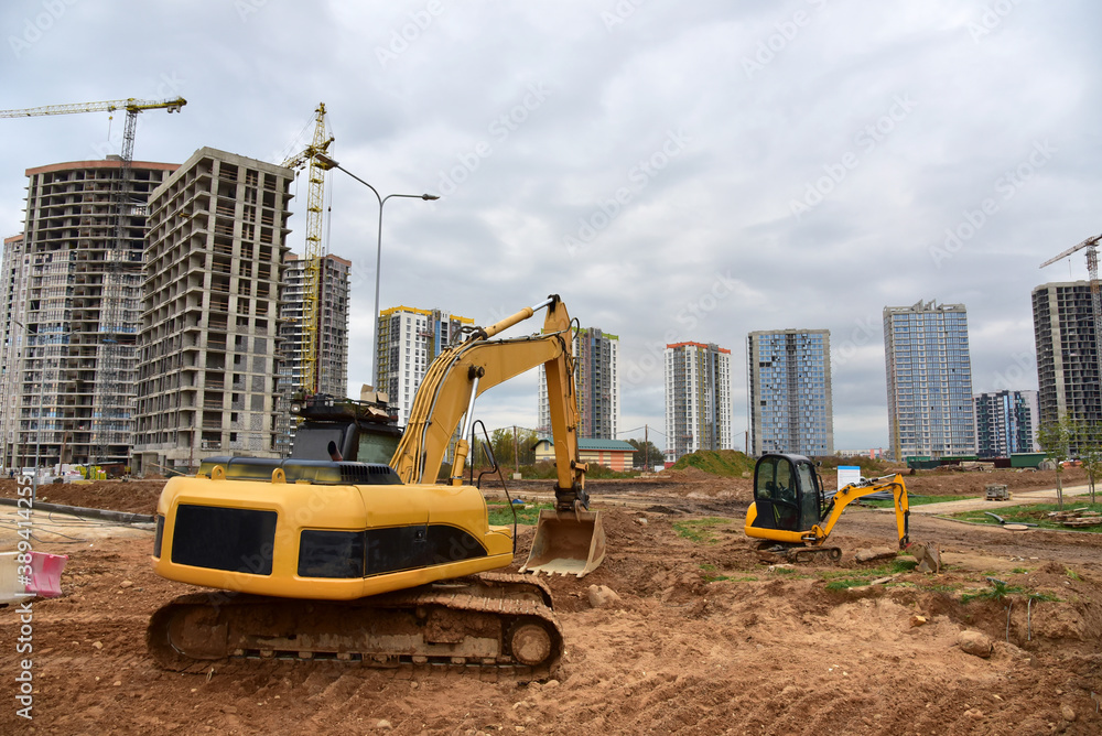 Excavator and mini excavator during excavation and road construction ...