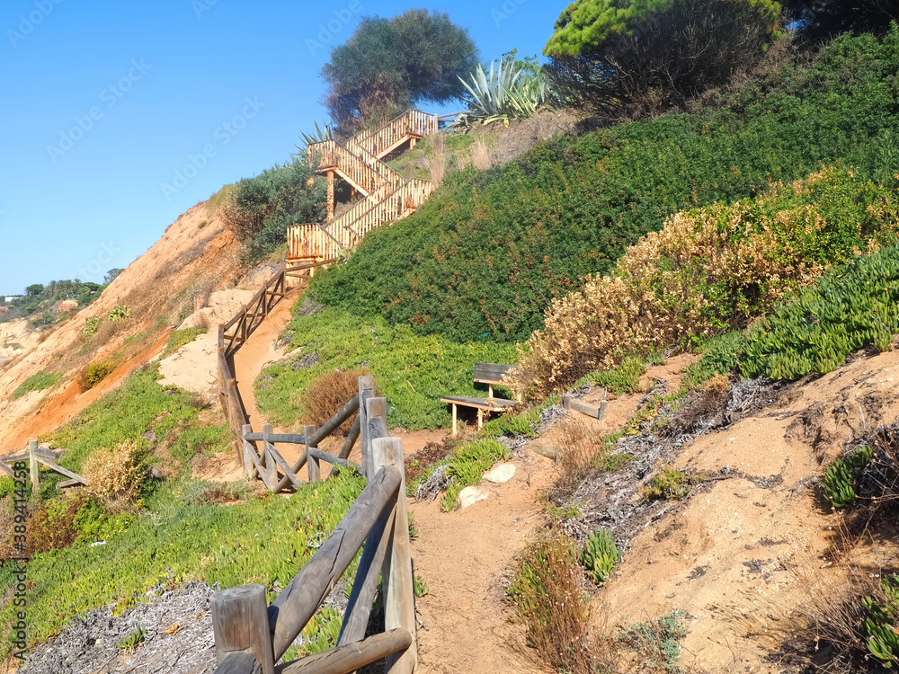 Hiking at the beach of Praia Maria Luisa, Olhos da Agua, Albufeira, at ...