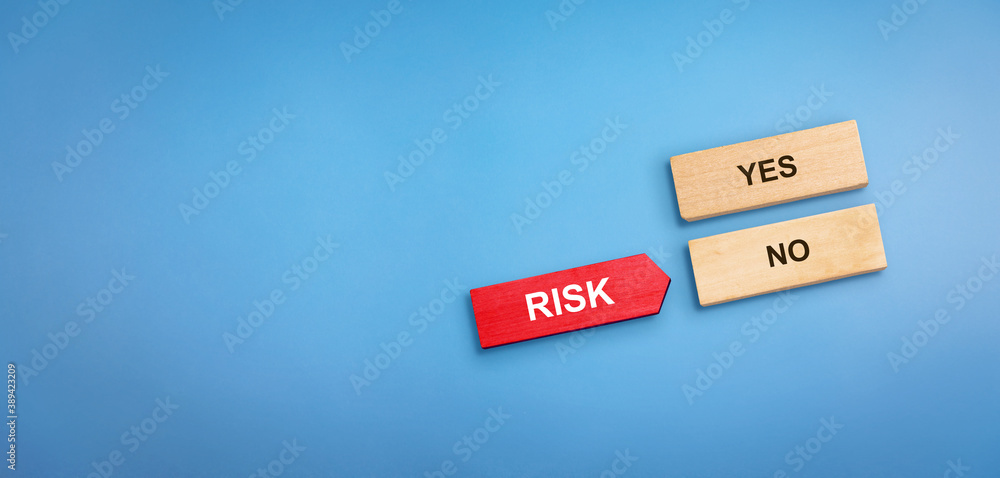 Risk concept with text Yes and No. Risk wooden block pointing No block ...