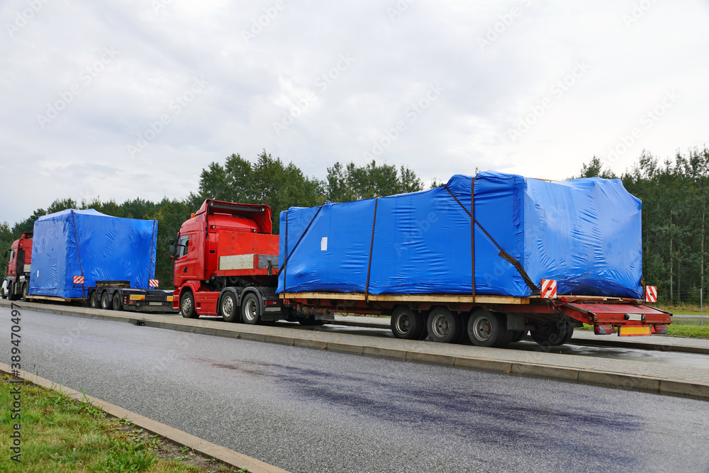 Oversize load, long vehicle or exceptional convoy. A trucks with a ...
