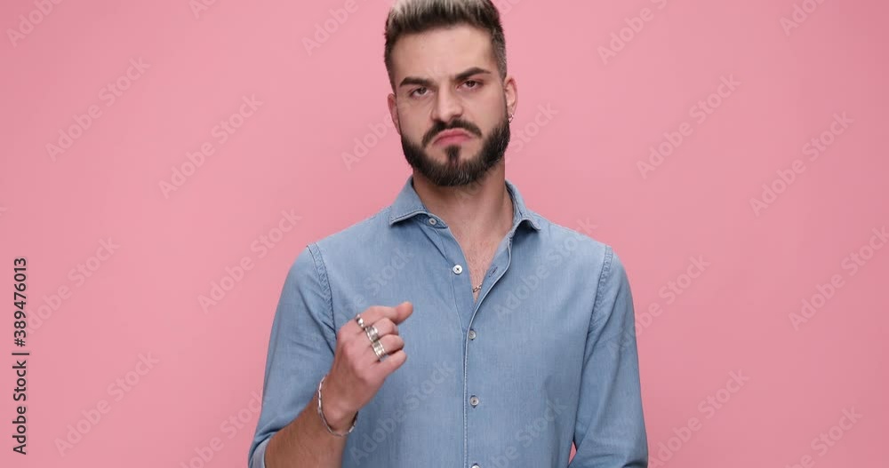 attractive casual man feeling desperate over someone, being aggresive ...