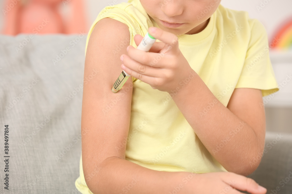 Little diabetic boy giving himself insulin injection at home Stock ...