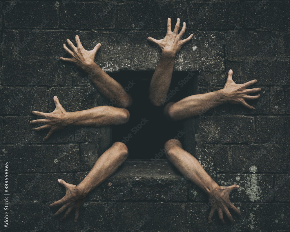 Zombie hands rising out from old damaged window. Darkness horror and ...