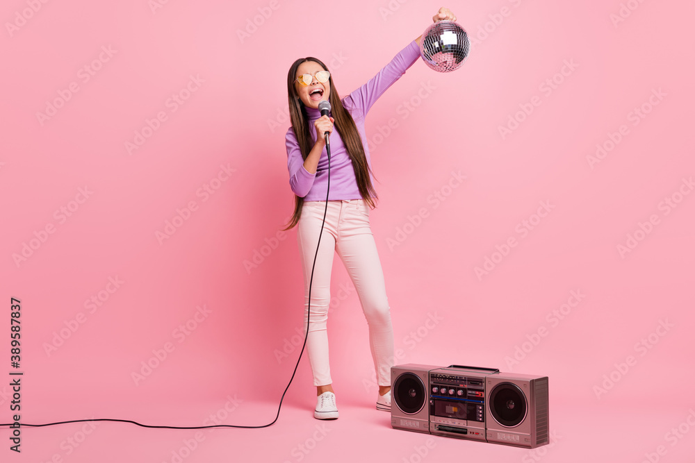 Full size photo of little kid girl sing song mic hold disco ball with ...