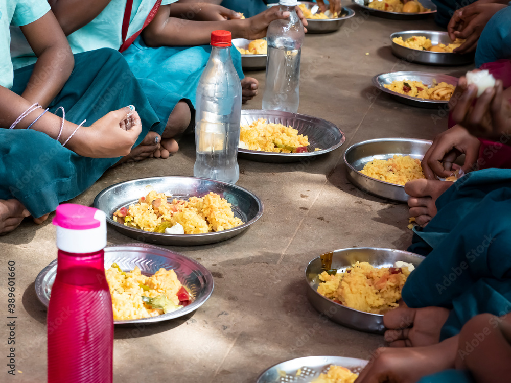 Unidentified poor classmates children with uniforms sitting on the ...