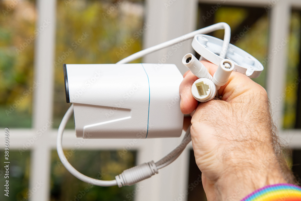 POV male hand holding against home window background new CCTV ...