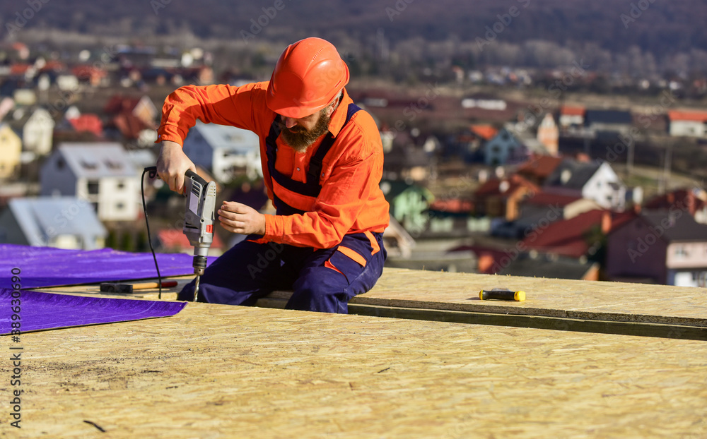 Master repair roof. Flat roof installation. Roofer constructing roof ...