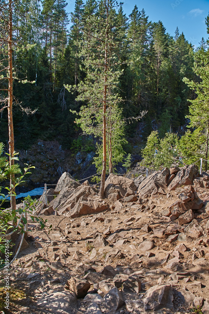 Plain waterfall Kivach.Long multistage flat waterfall. Seething waves ...