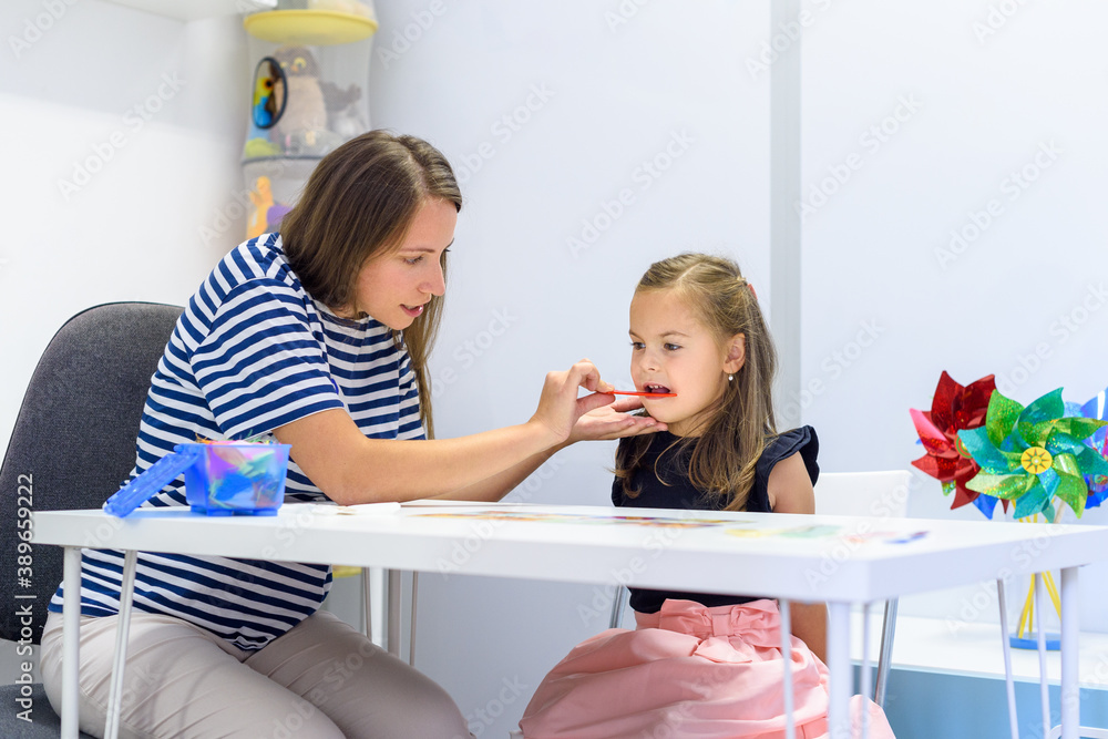 Children speech therapy concept. Preschooler practicing correct ...