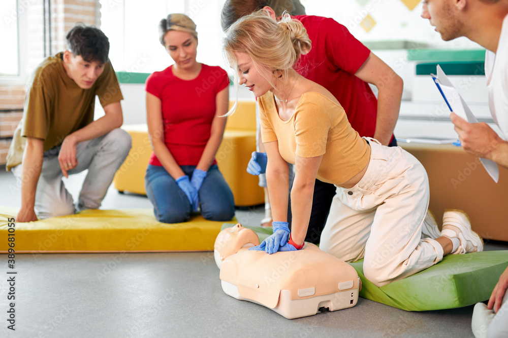 Poster caucasian people practice an exercise of resuscitation during ...