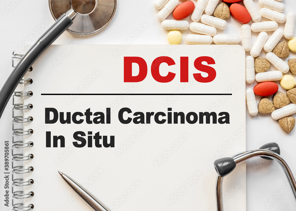 Page in notebook with DCIS Ductal Carcinoma In Situ on white background ...