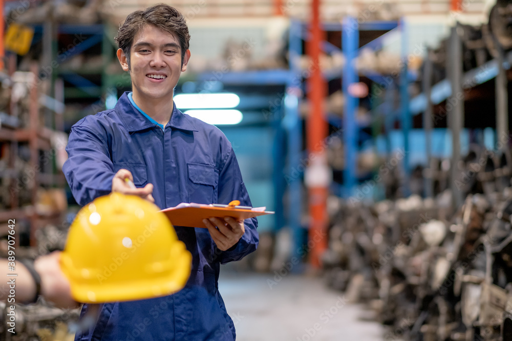 Portrait of factory man with smiling and action of receive hardhat for ...