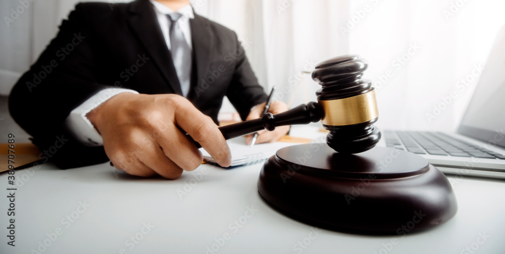 Justice and law concept.Male judge in a courtroom with the gavel ...