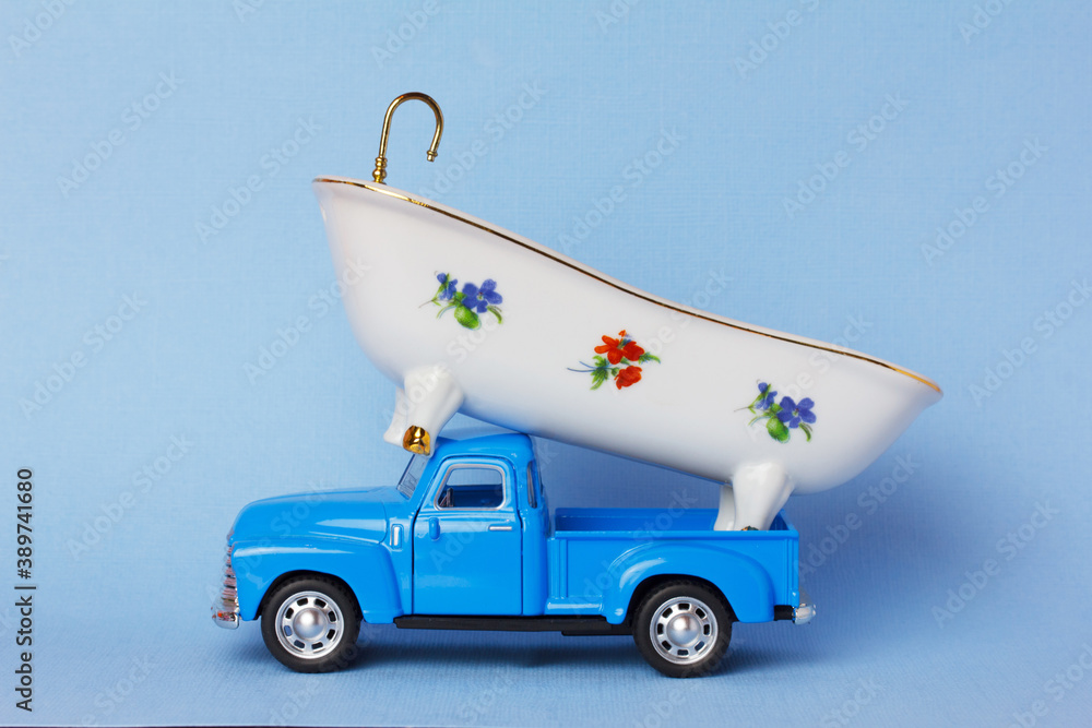 Blue pickup truck is carrying a heavy object. Delivery of heavy ...