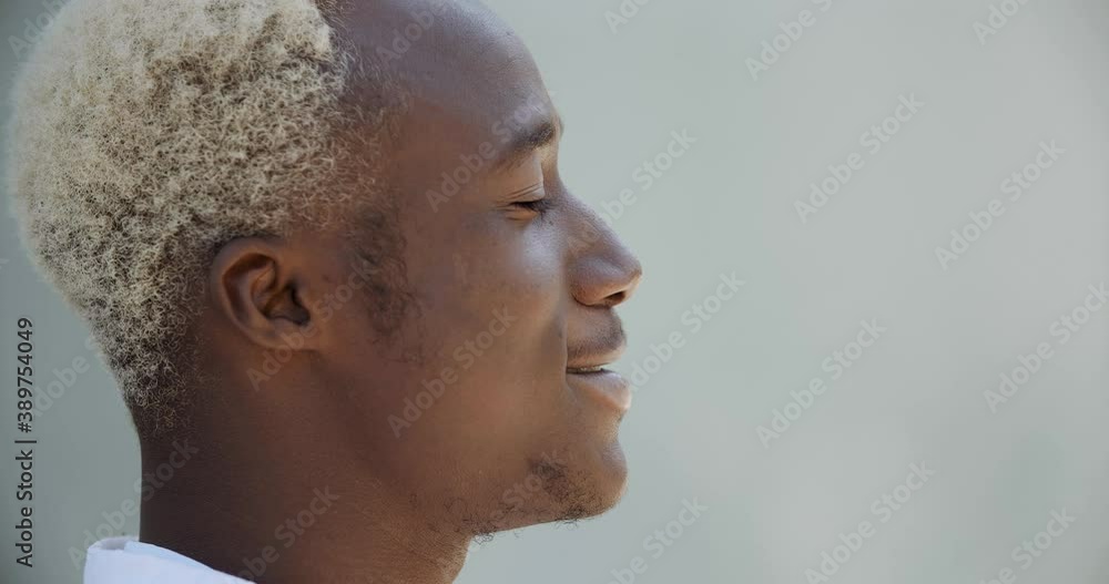 Side view african man afro american guy teenager blond student standing ...