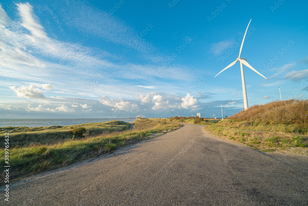 Long road surrounded by the giant wind turbines in Zeeland - great for ...