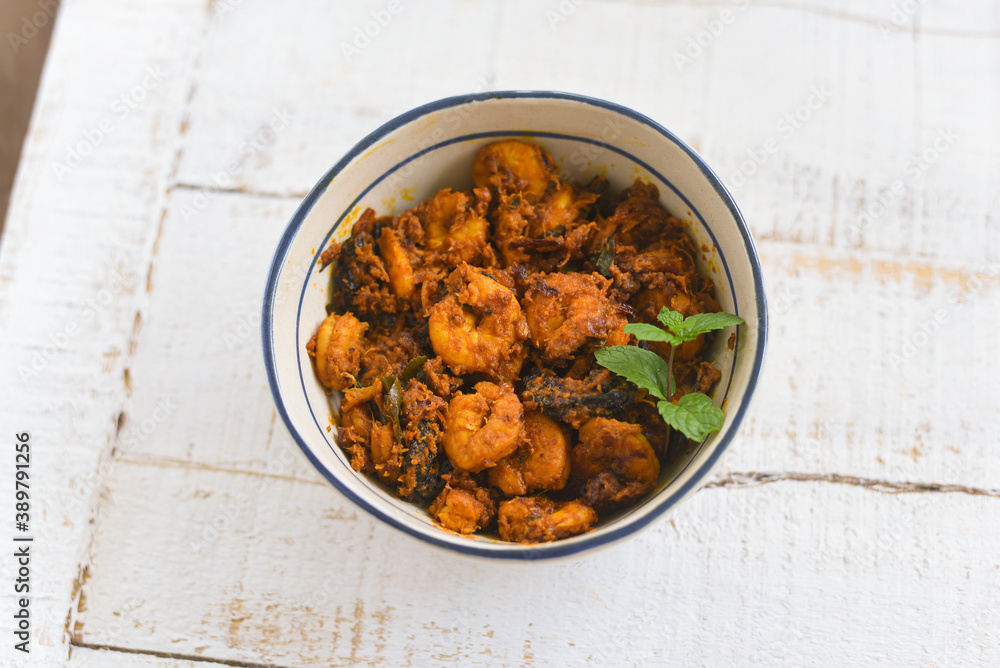 Top view spicy hot Bengali Prawn roast , shrimp masala fish curry ...