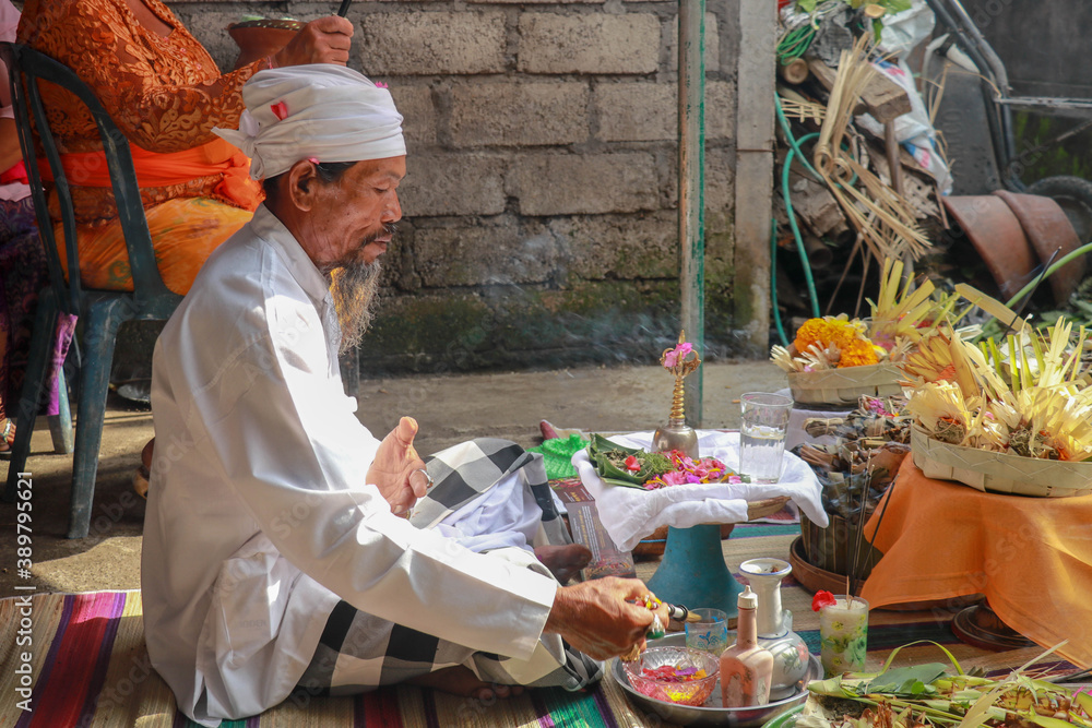 The Hindu Priest or widely known as Pedanda by the Balinese, blessing ...