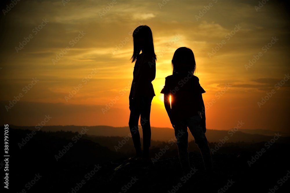 Silhouette photo of a human with a sunset background Stock Photo ...