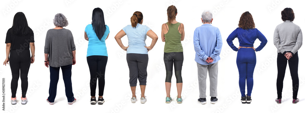 rear view of a group of women wearing sportswear on white background ...