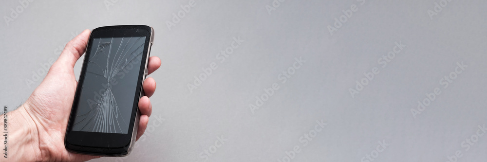 Hand holding mobile phone with broken screen on white background Stock ...