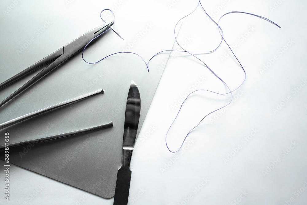 Surgical instruments on metal tray with space for text. Flat lay ...