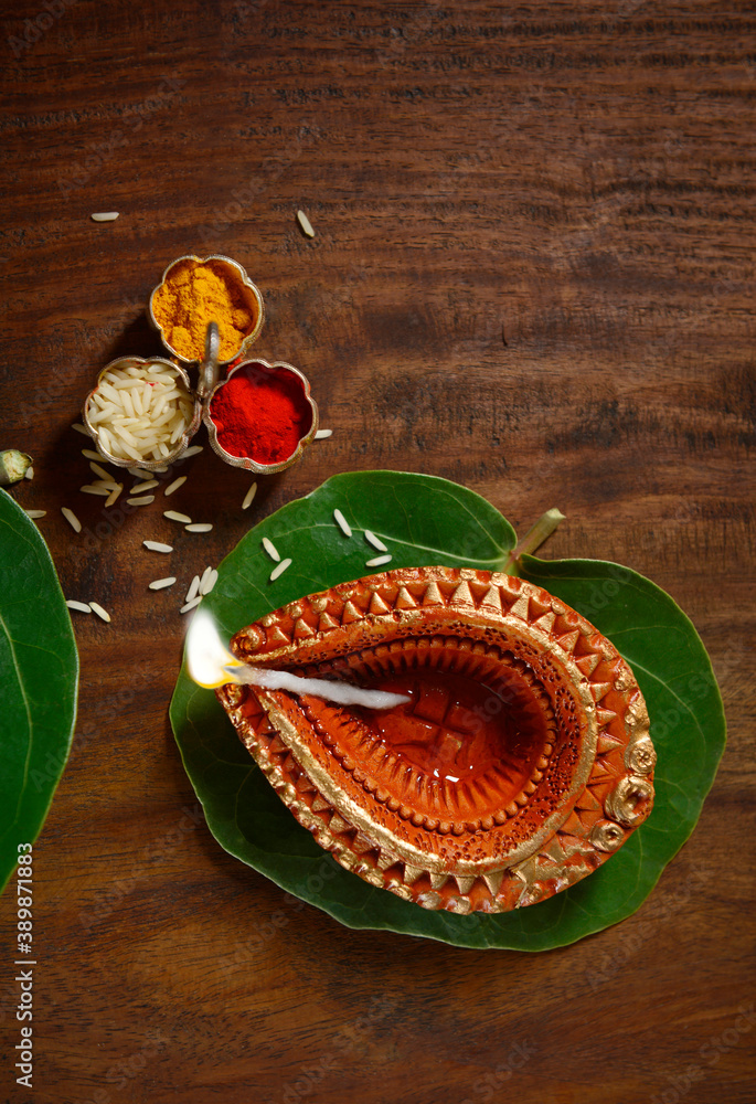 Hindu religious rituals set up and objects. Top view of clay lamp with ...