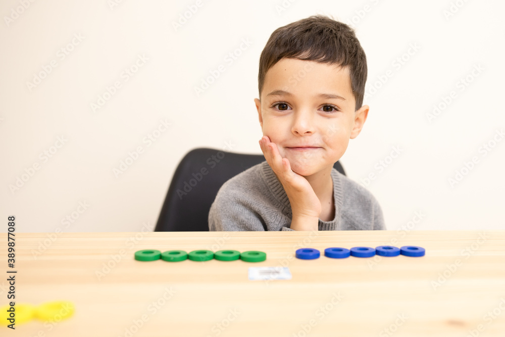 Elementary school child plays a math game. Did the task: the topic of ...