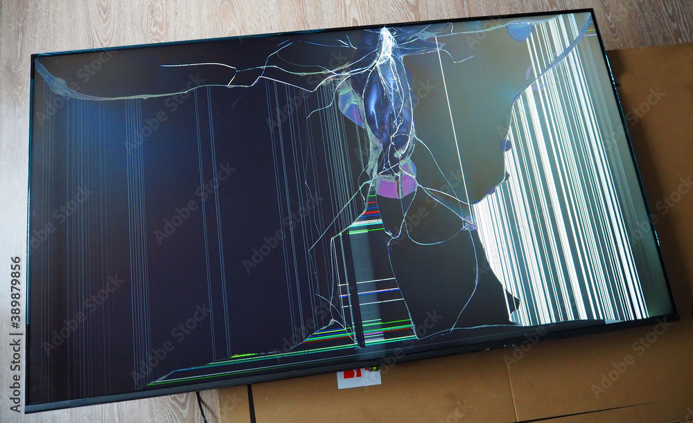 Broken led TV matrix. Damage to the screen of a modern TV as a result ...