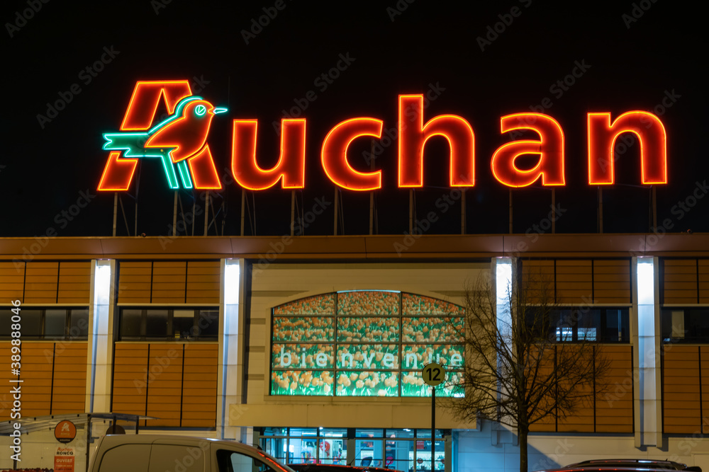 Roncq,FRANCE-February 27,2019: Night view of Auchan supermarket logo ...