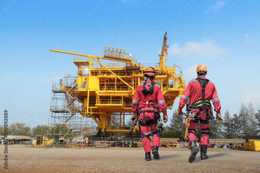 Safety man walking with equipment full safety harness, in Construction ...