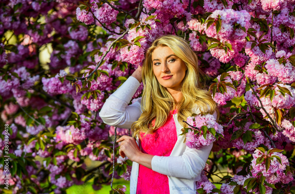 Spring freshness. pink cherry tree blossom. beautiful woman in dress ...