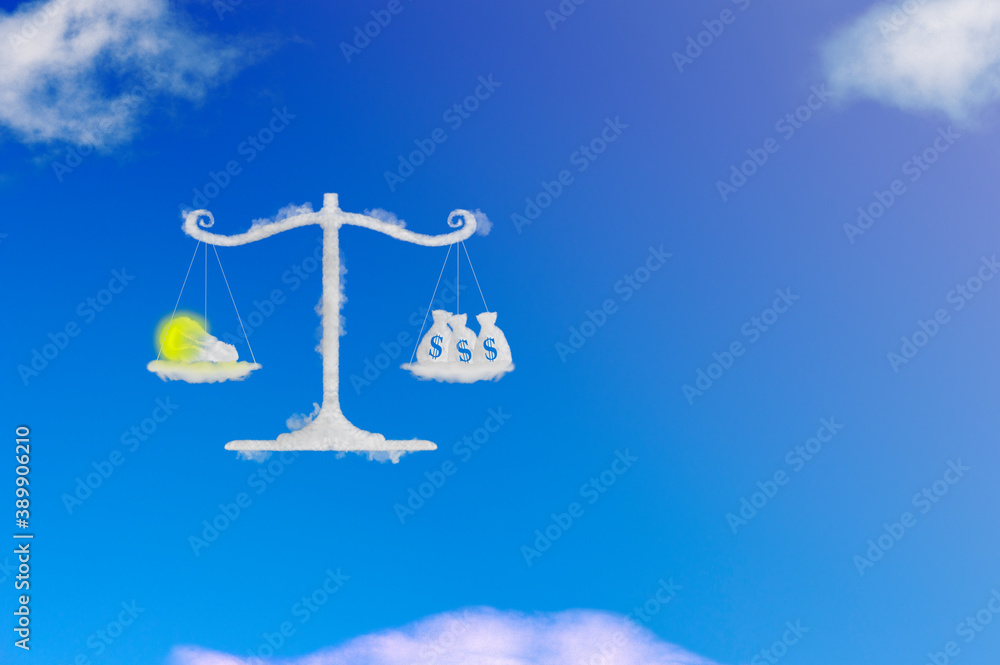 Cloud shape of light bulb idea and money on balance scale, blue sky ...