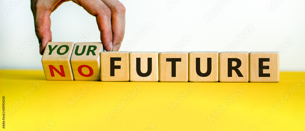 Male hand flips wooden cubes and changes the inscription 'no future' to ...