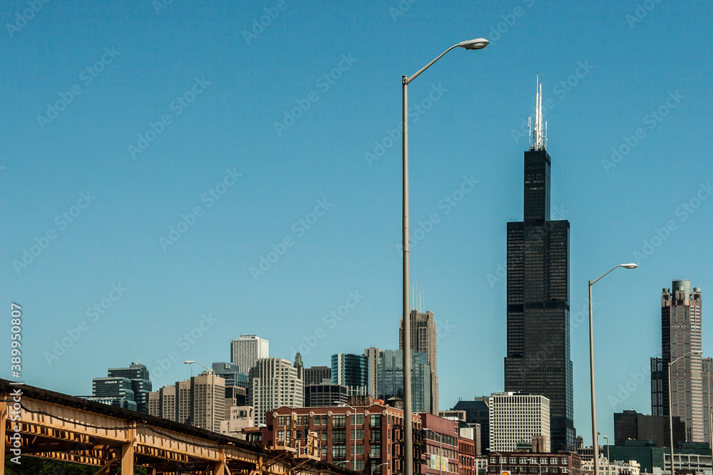 Daylight view of Chicago skyline with buildings, elevated overpass, and ...