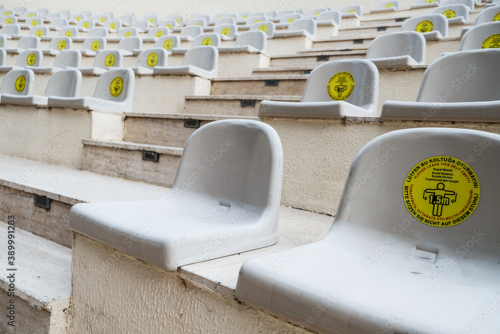 Avoiding crowds during show in amphitheater. Warning sign: leave some ...