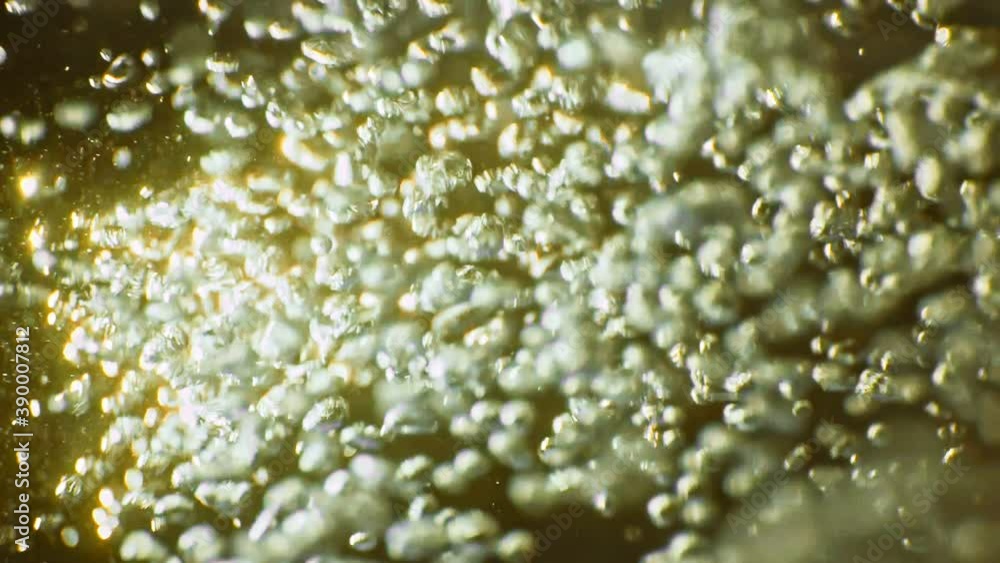 Video of underwater colorful bubbles rising to surface in slow motion 180fps. Close up ...