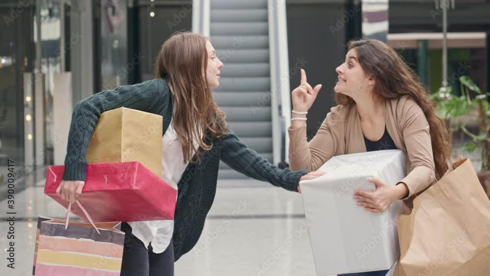 Two Attractive Woman is Fighting For Shopping. Shopaholics are Fighting ...