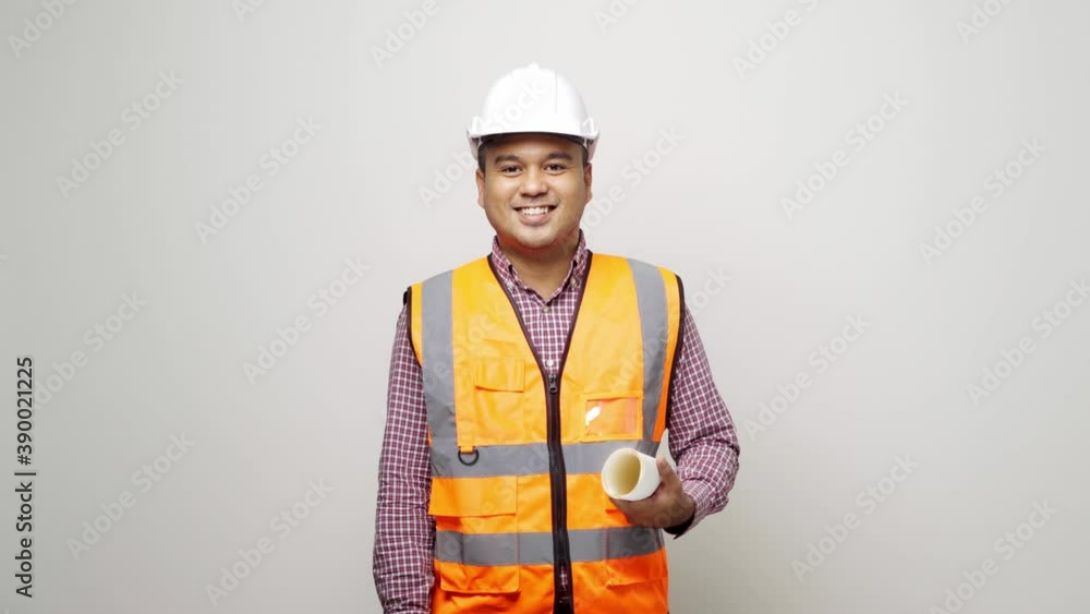 Young handsome asian civil engineer holding paperwork blueprint roll ...