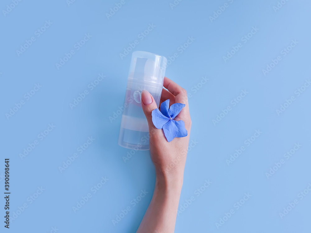 Mockup of transparent bottle of intimate lubricant gel, female hand and ...
