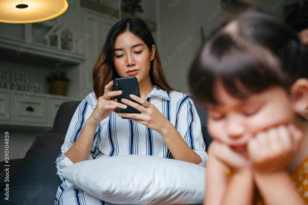Asian little girl being ignore by her parents at home. Stock Photo ...