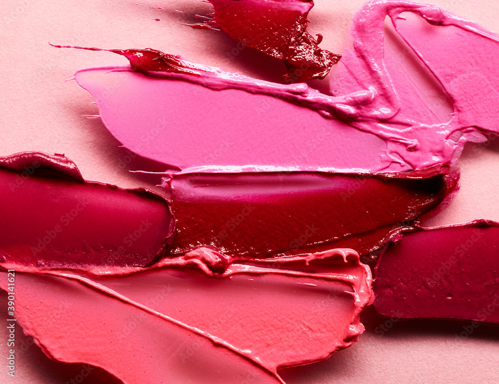 Smudged lipsticks different colors over pink background Stock Photo ...