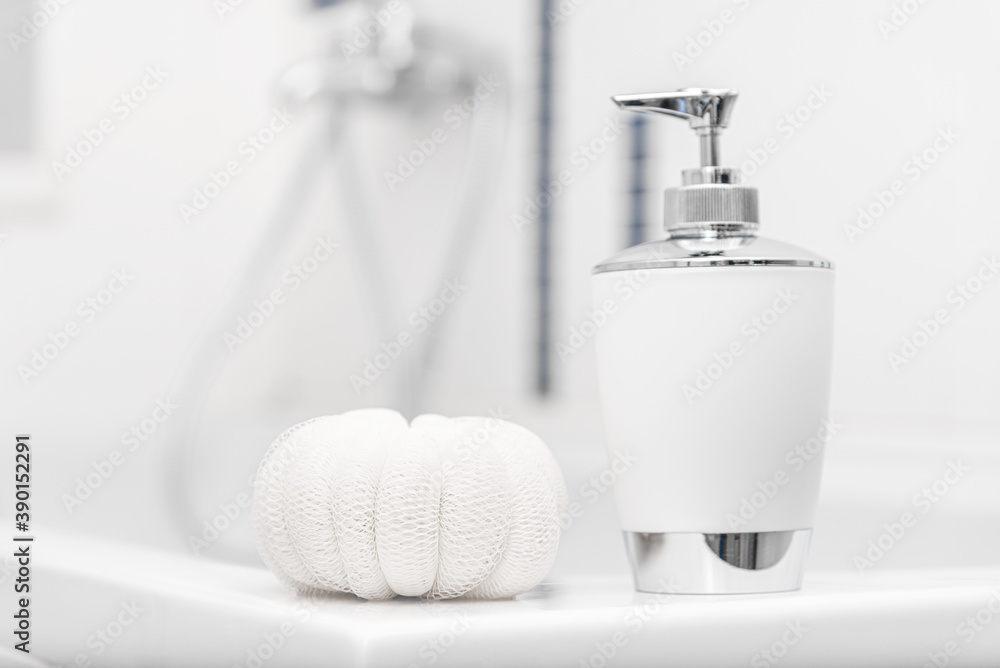 Liquid and ordinary soap in the bathroom. Cleanliness of hands and body ...