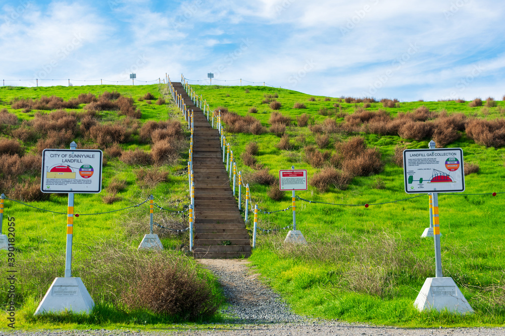 Sign at former landfill informs about waste disposal site and landfill ...