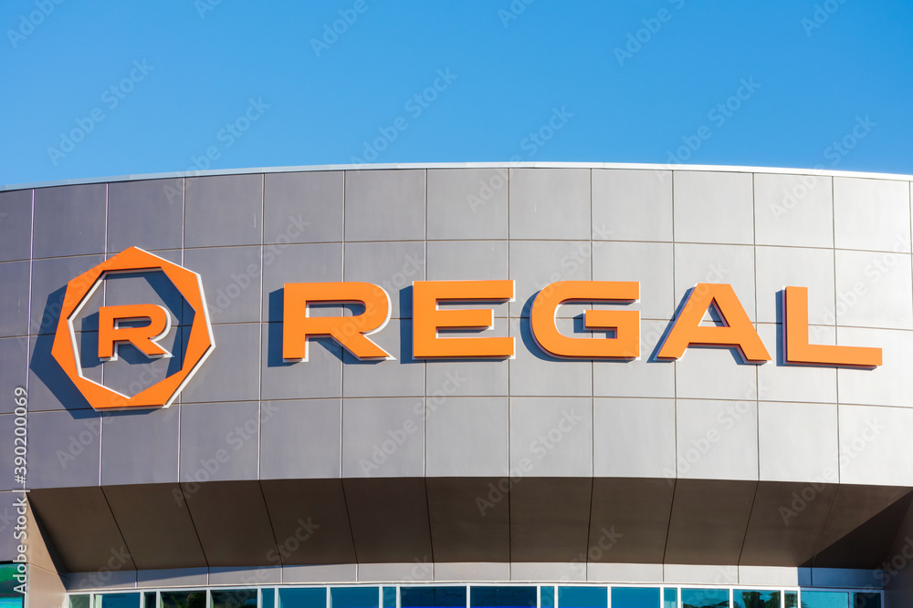 Regal logo sign on facade of the movie theater. Regal Cinemas is an ...