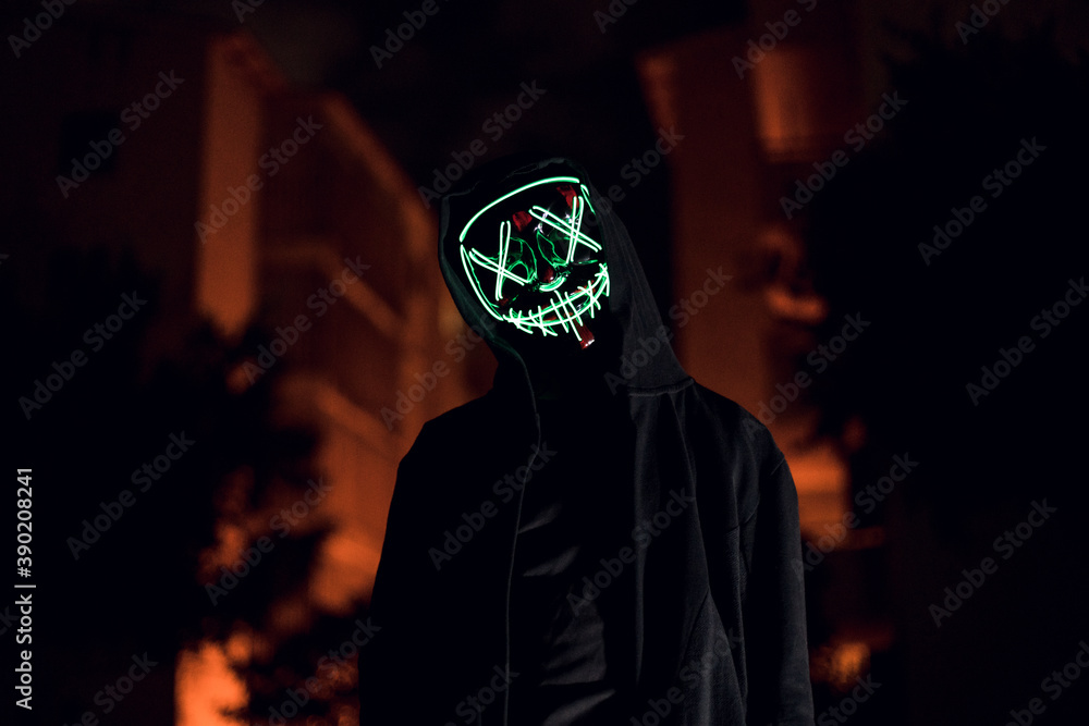 Scary masked man at night Stock Photo | Adobe Stock