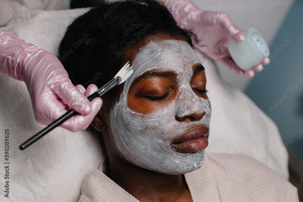African American woman in spa cabinet Stock Photo | Adobe Stock