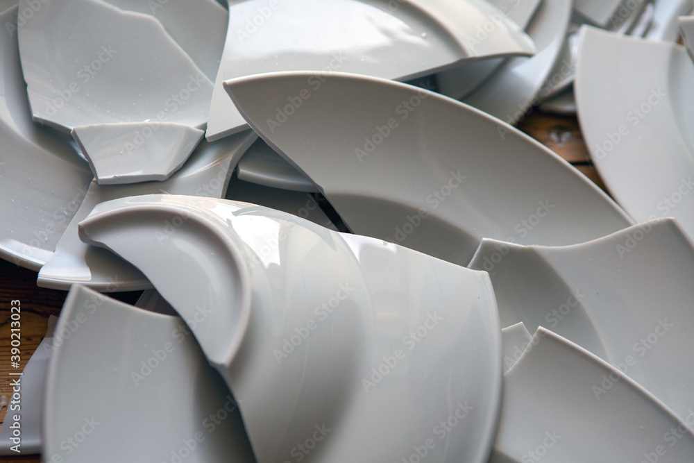 pile of broken white plates shattered on floor Stock Photo | Adobe Stock