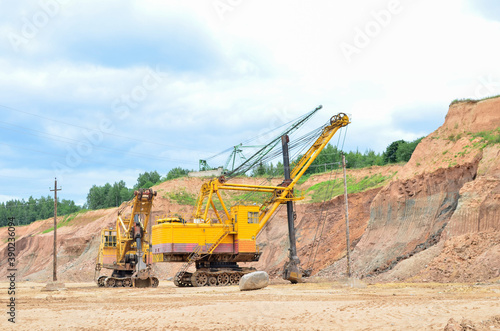 Huge mining excavator in the limestone open-pit. Biggest digger working ...